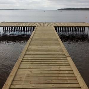 A wooden pontoon on Moutchic Beach in Lacanau